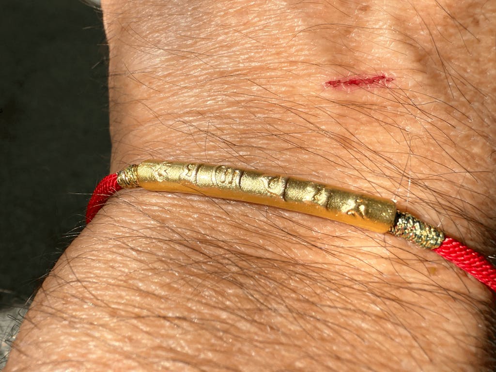 Tibetan Red String Bracelet - Buddhist Lucky Charm | Buddha & Karma