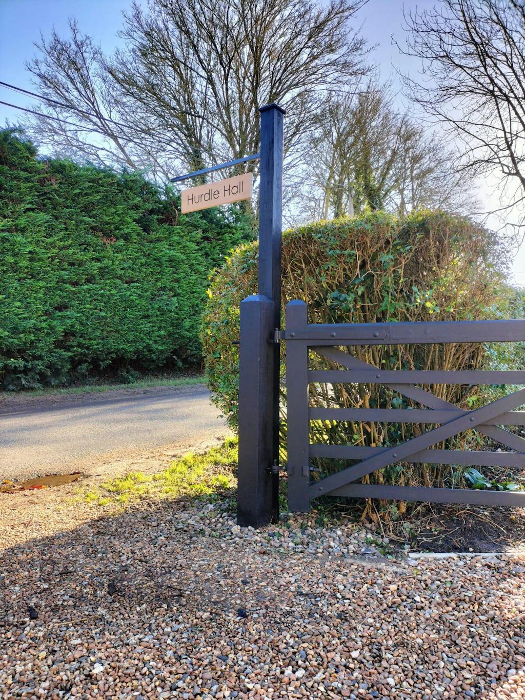 Hanging sign bracket - Hartwood Timber