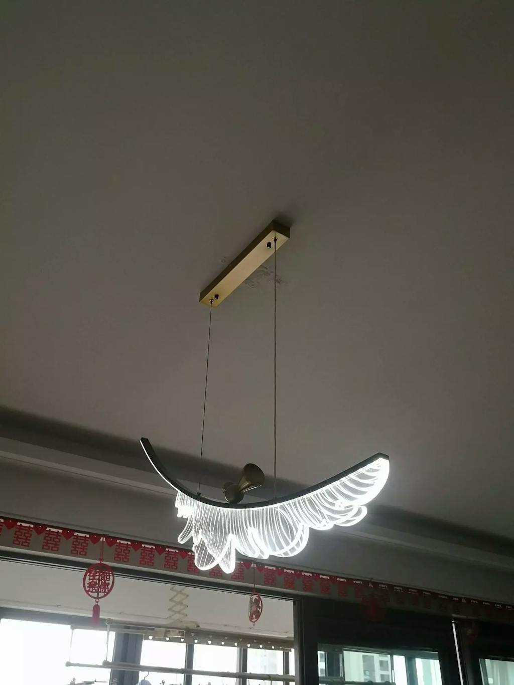 Golden Feathered Wing Suspension Lights for Enchanted Interiors