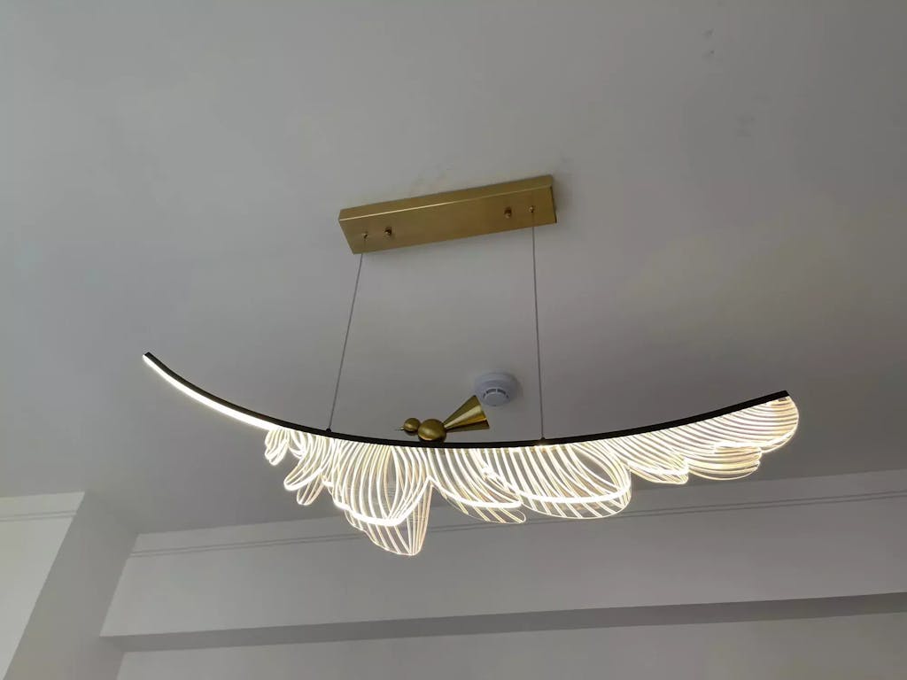 Golden Feathered Wing Suspension Lights for Enchanted Interiors