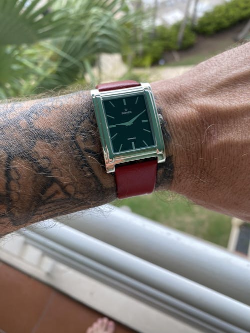 Tokyo, a rectangular watch in polished steel with green dial