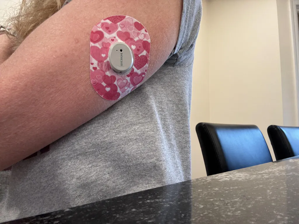 Adhesive tape designed for glucose monitoring devices