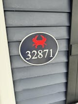 Oval house number with Inset numbers and border – The Carving Company